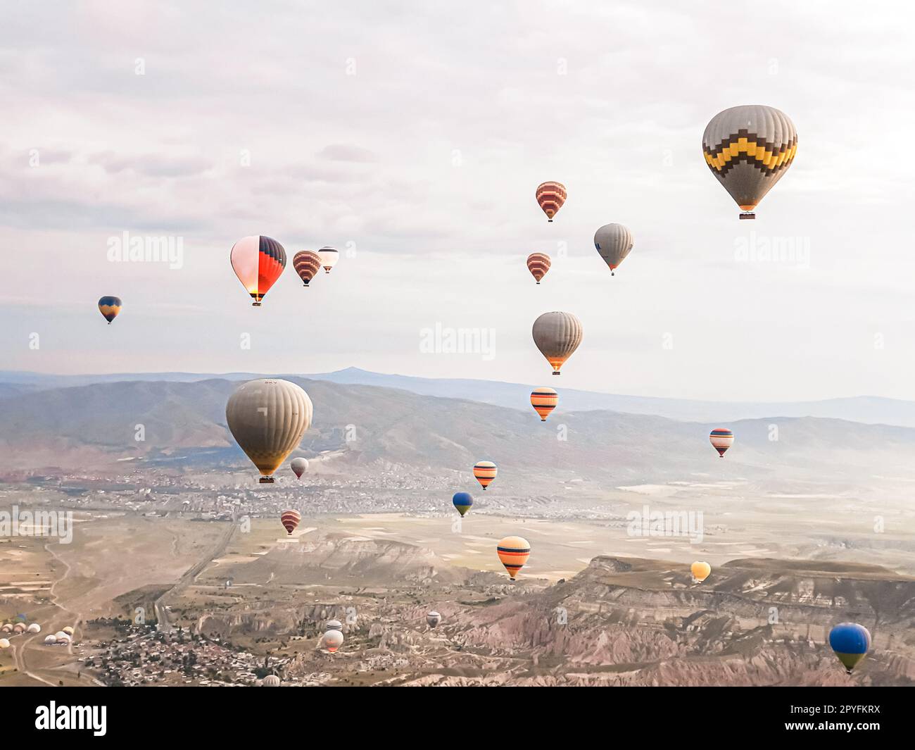 Flying in sky many bright colored beautiful balloons into air in ...