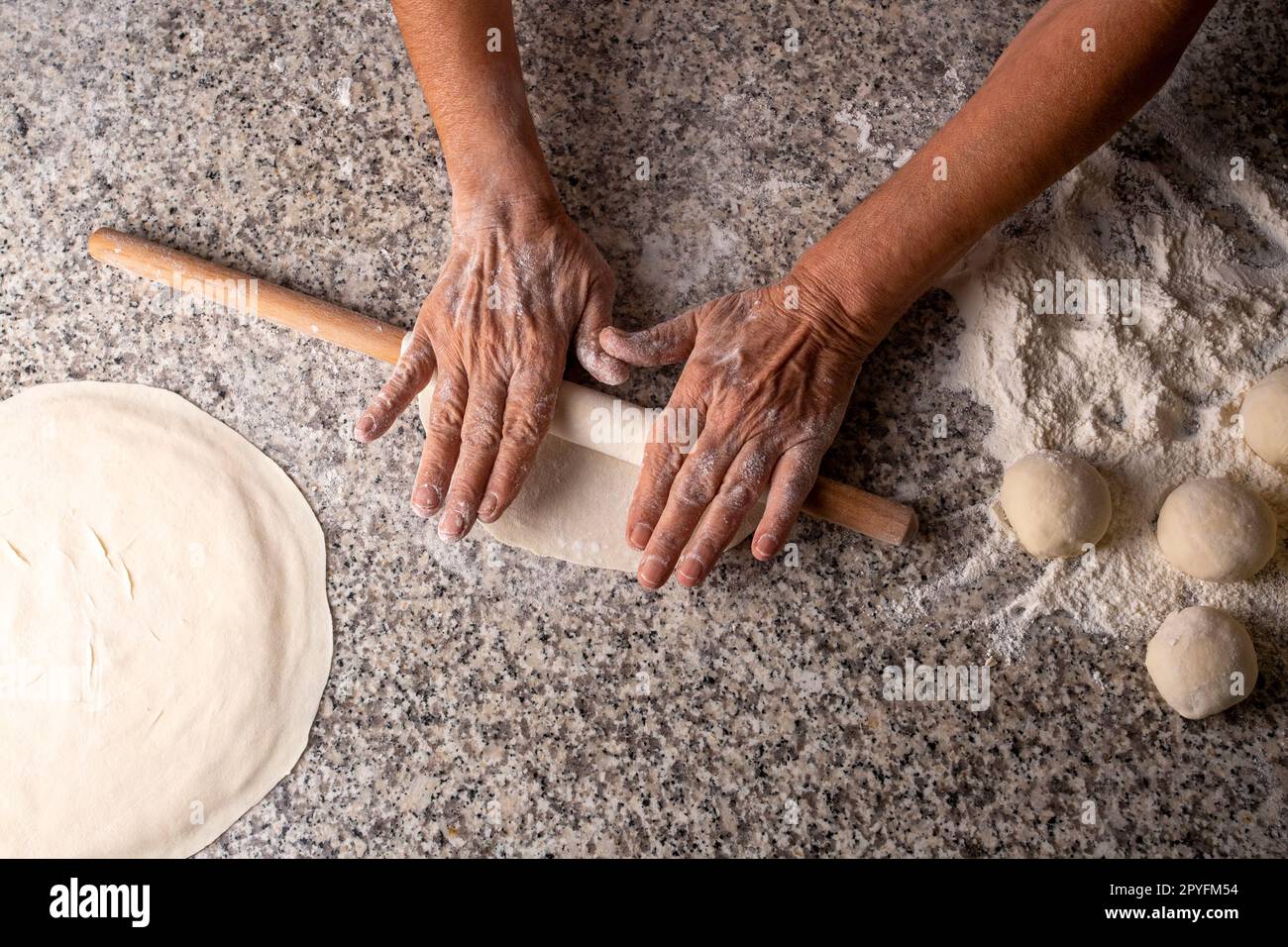 Making bread with a rolling pin, yeast dough, Turkish style Stock Photo ...