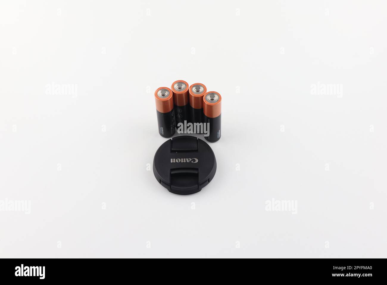 Batteries and canon lens protector cap Stock Photo - Alamy