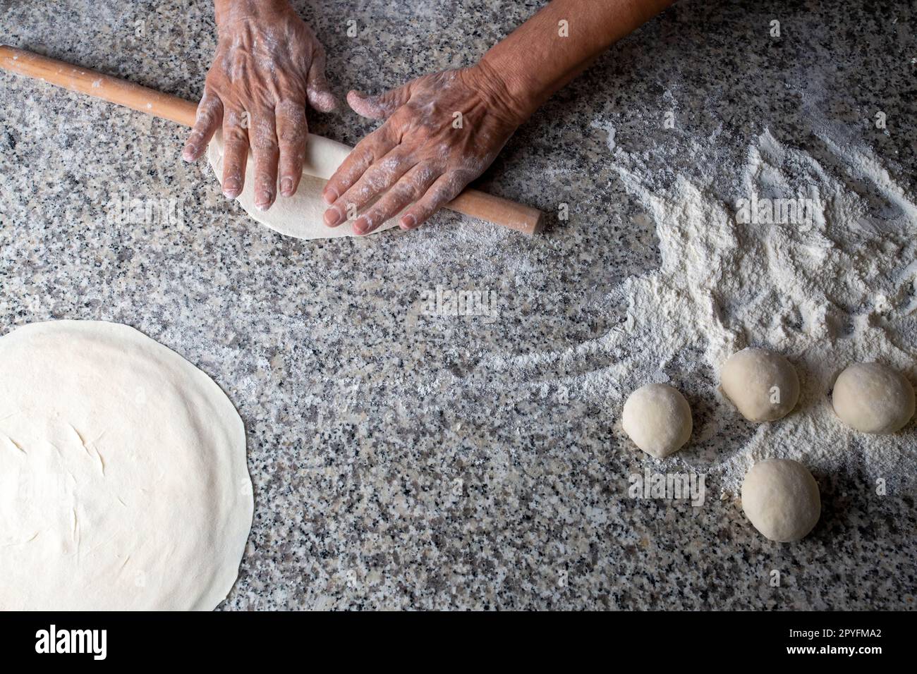 Making bread with a rolling pin, yeast dough, Turkish style Stock Photo ...