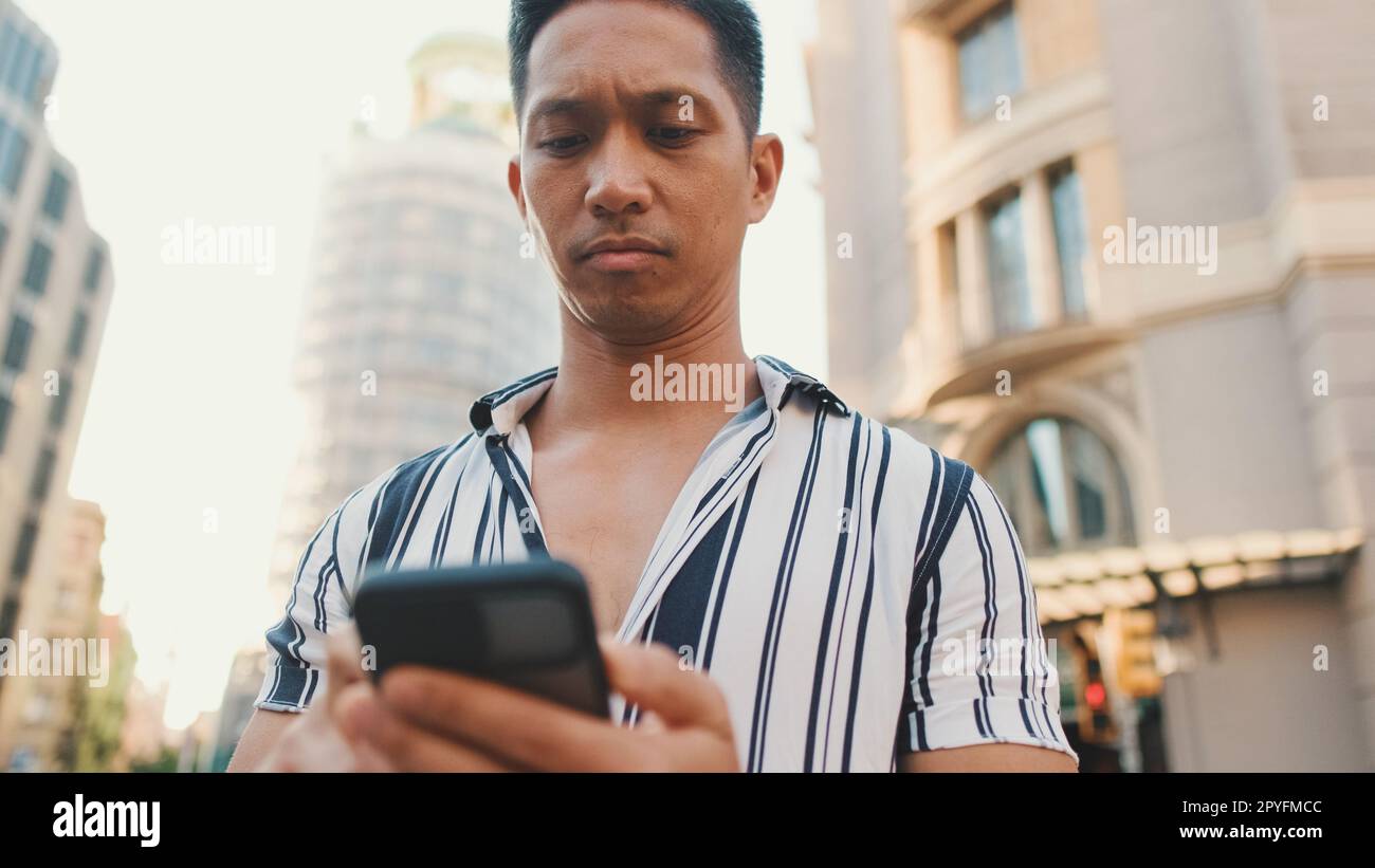 Young man tourist uses maps hi-res stock photography and images - Alamy