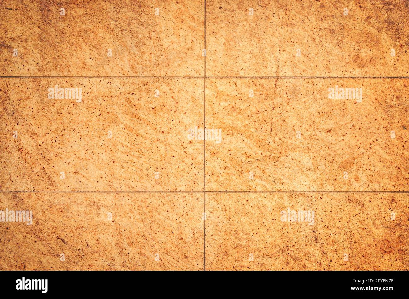 Building wall made of ceramic tiles. Beige tiles wall background or ...