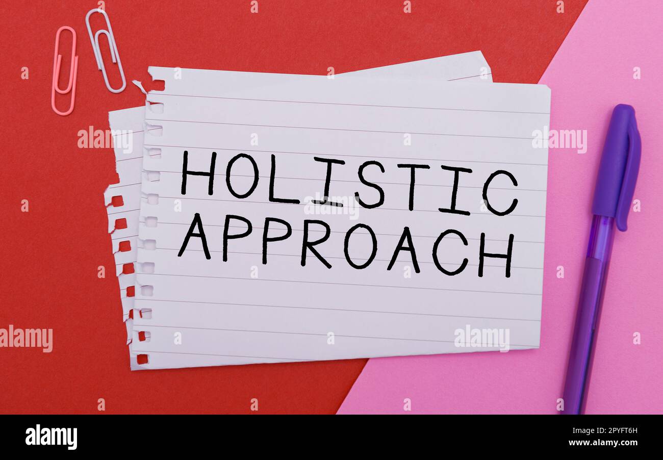 Hand writing sign Holistic Approach. Conceptual photo characterized ...