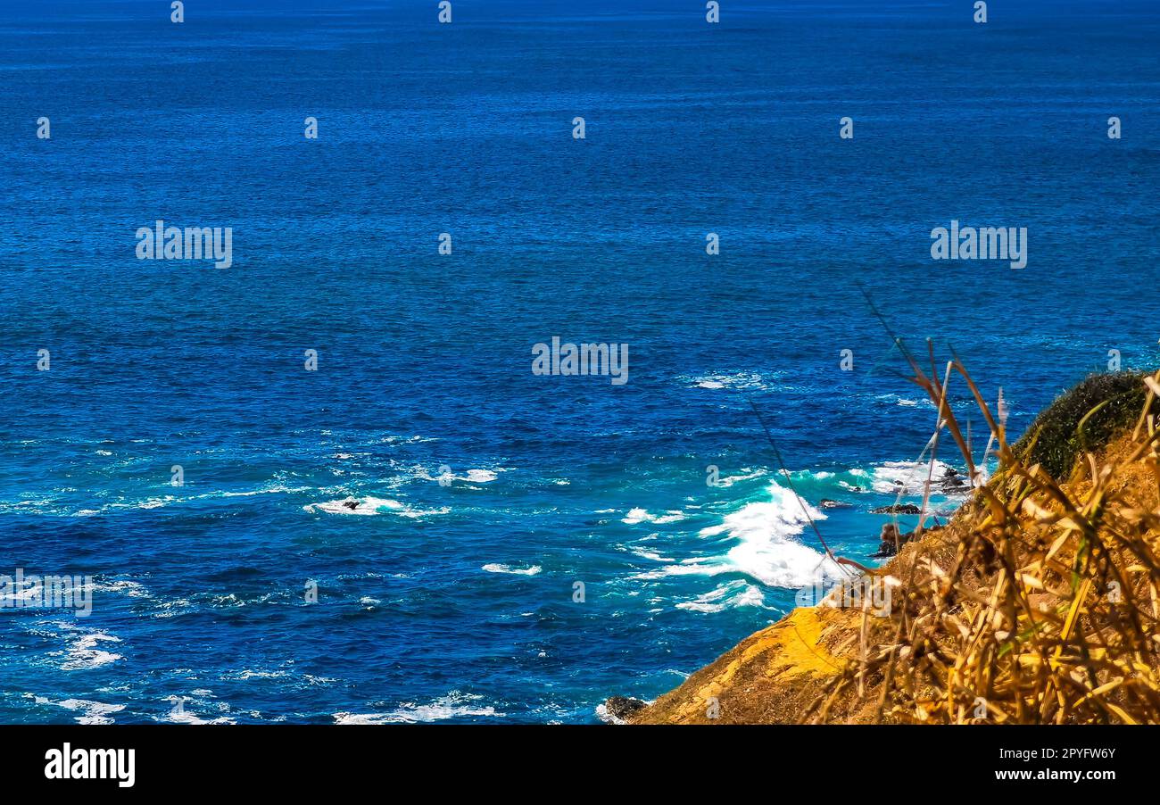 Beautiful rocks cliffs view waves at beach Puerto Escondido Mexico ...