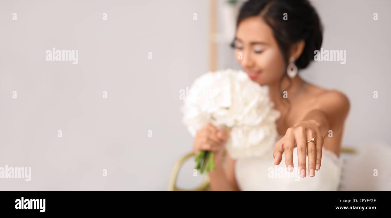 Beautiful young Asian bride showing her wedding ring. Banner for design ...