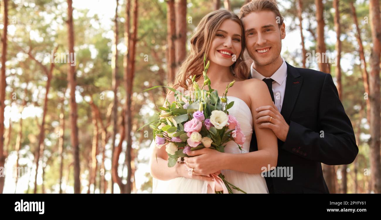 Happy couple celebrating their wedding outdoors Stock Photo - Alamy