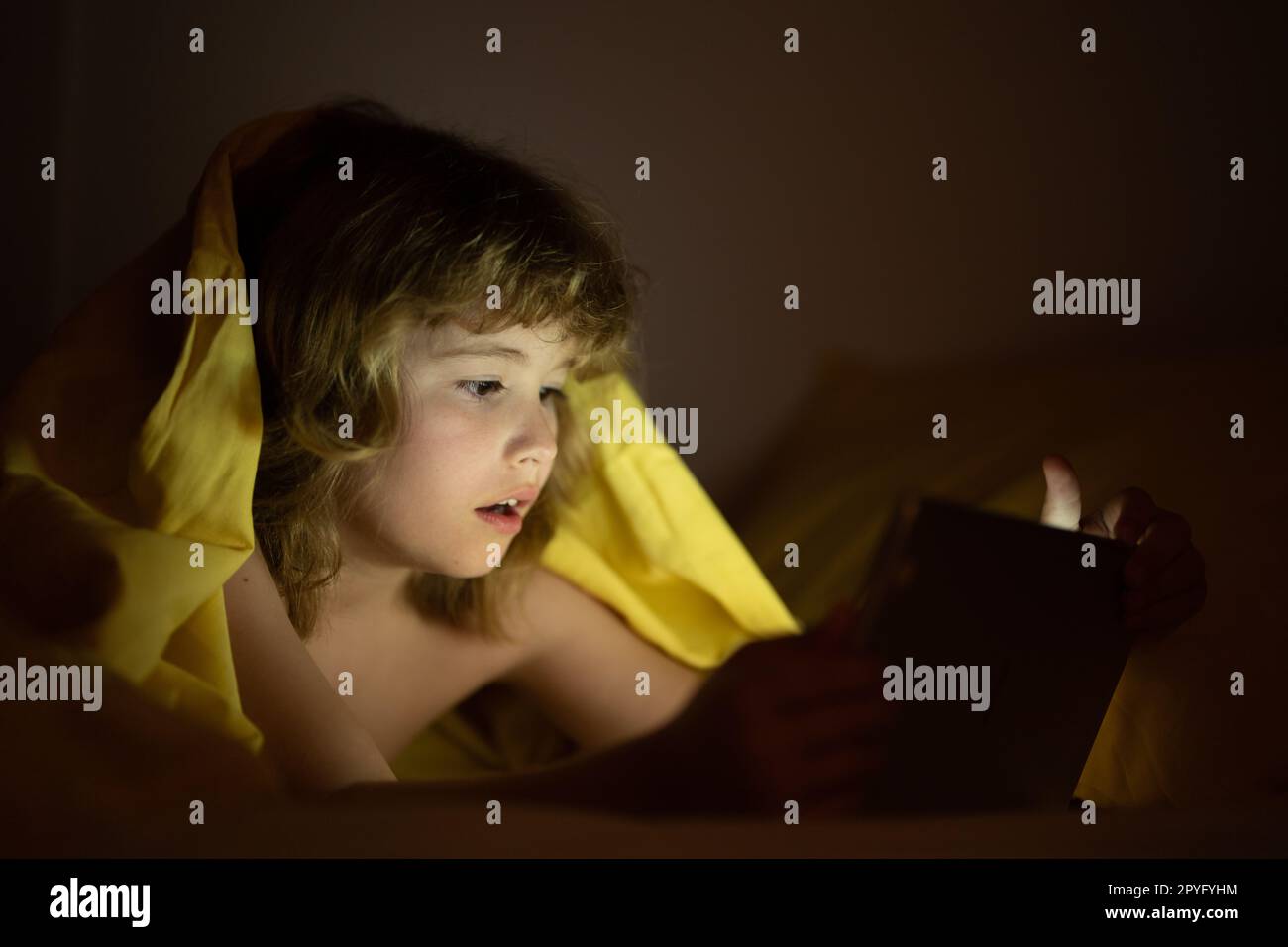 Kid is addicted to tablet, kid use tablet, watching cartoon. Child ...