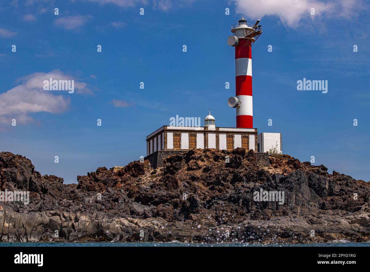 View of the lighthouse at Punta de Rasca from the Atlantic Stock Photo ...