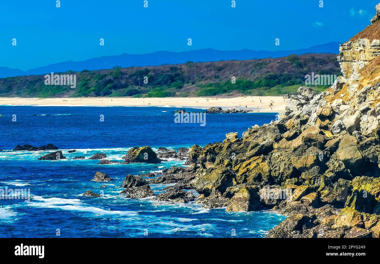 Beautiful rocks cliffs view waves at beach Puerto Escondido Mexico ...