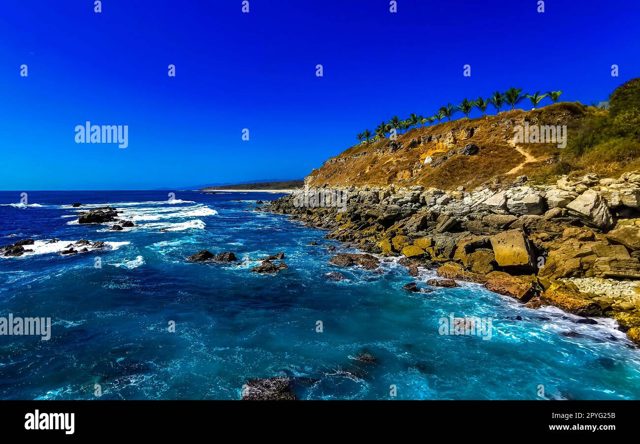 Beautiful rocks cliffs view waves at beach Puerto Escondido Mexico ...