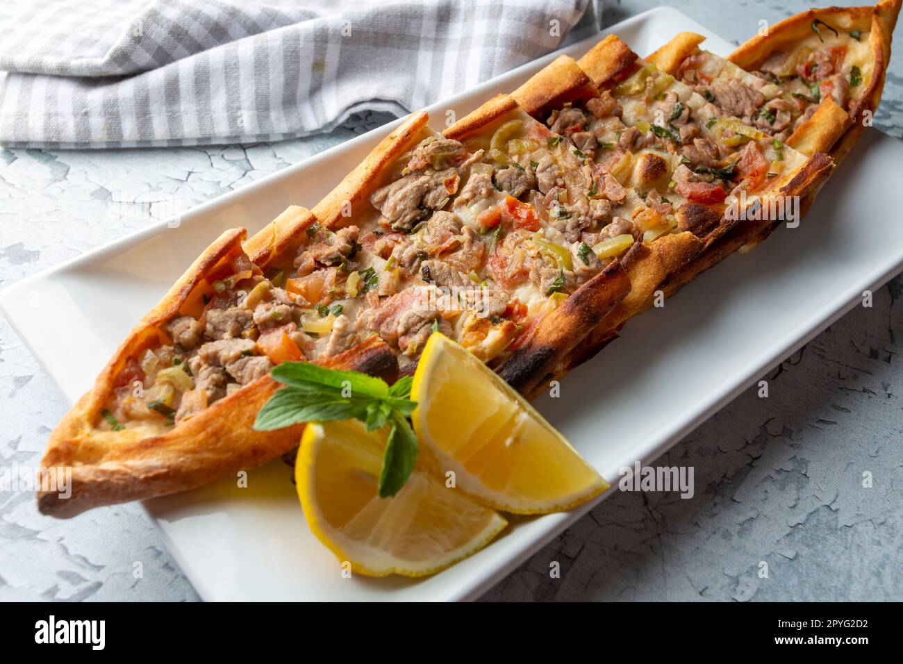 Traditional delicious Turkish food, meat pide (Turkish name; Kusbasi ...