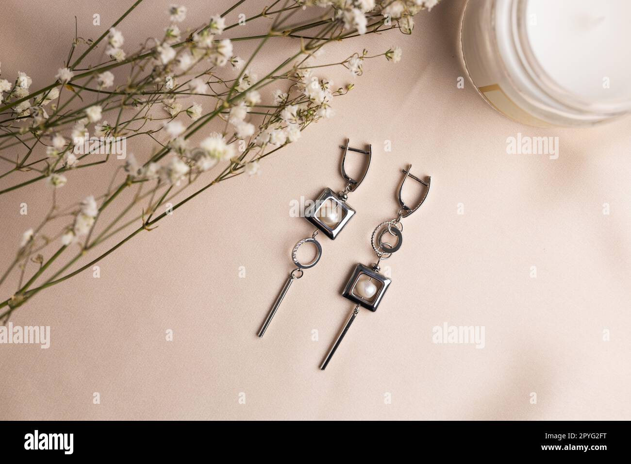 Earrings made of natural stones pearl. Natural mineral texture ...