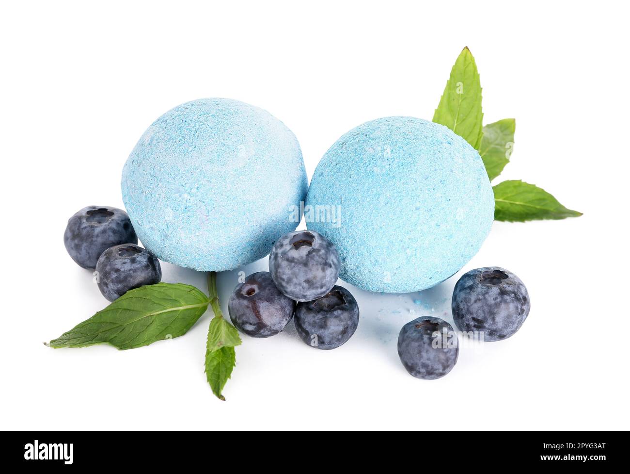 Bath bombs with blueberry on white background Stock Photo - Alamy