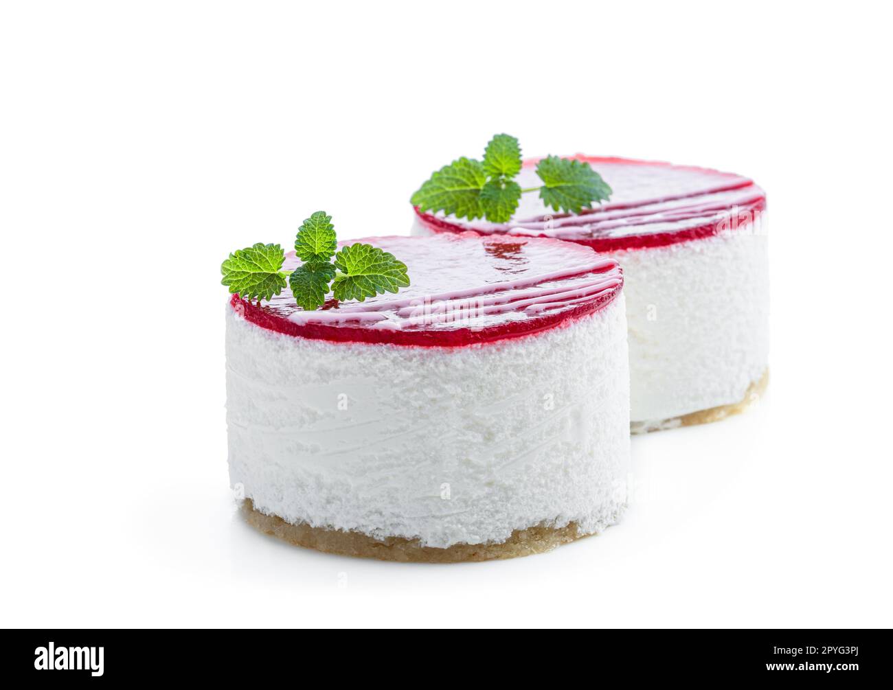 Mini cheesecakes with red fruits jam topping isolated on white Stock ...