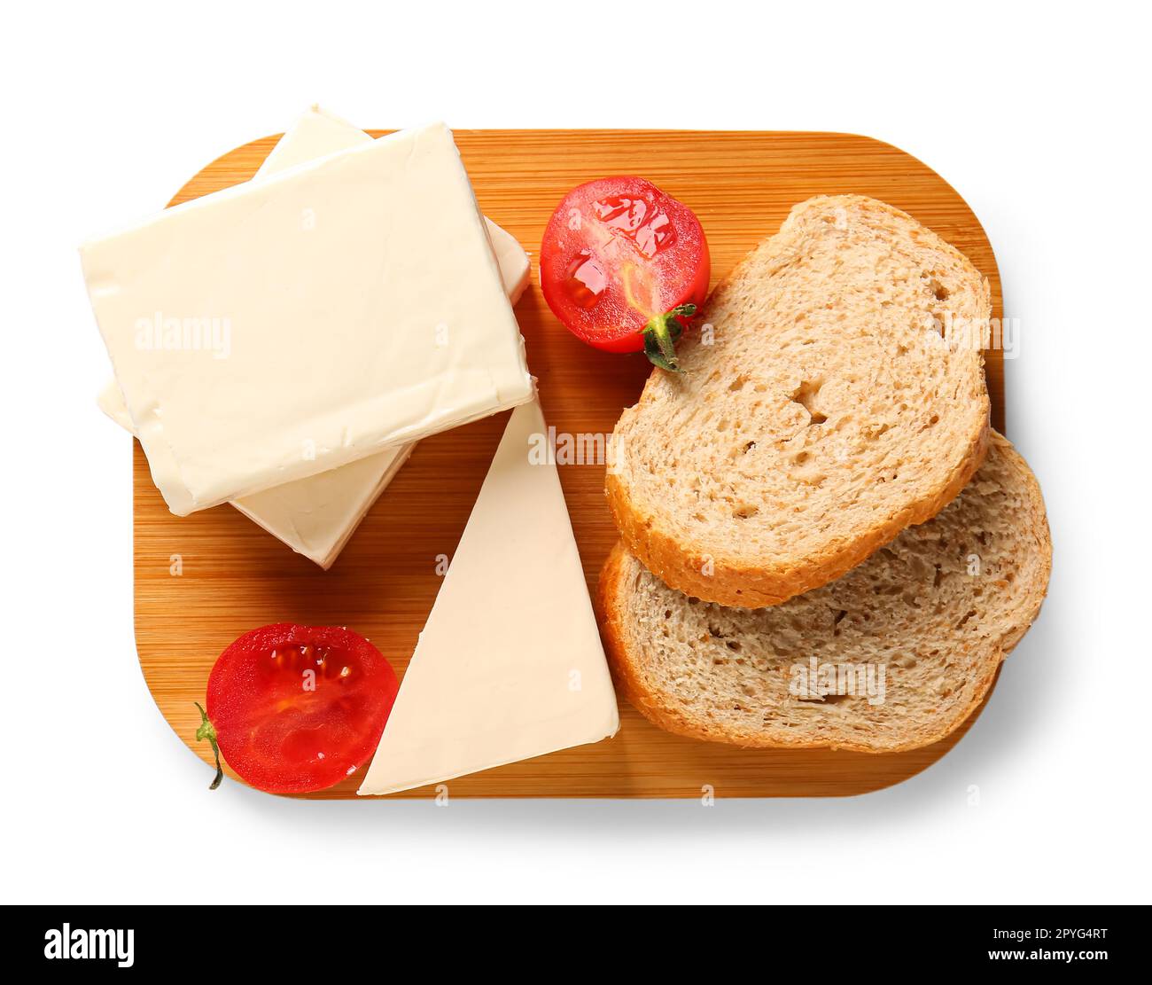 Board with processed cheese, bread and tomatoes on white background ...