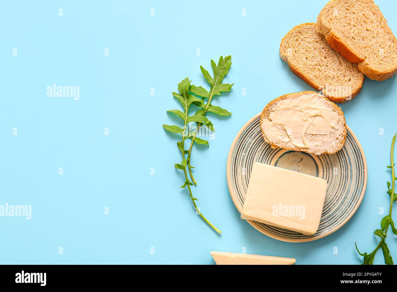 Plate and sandwich with processed cheese on blue background Stock Photo ...