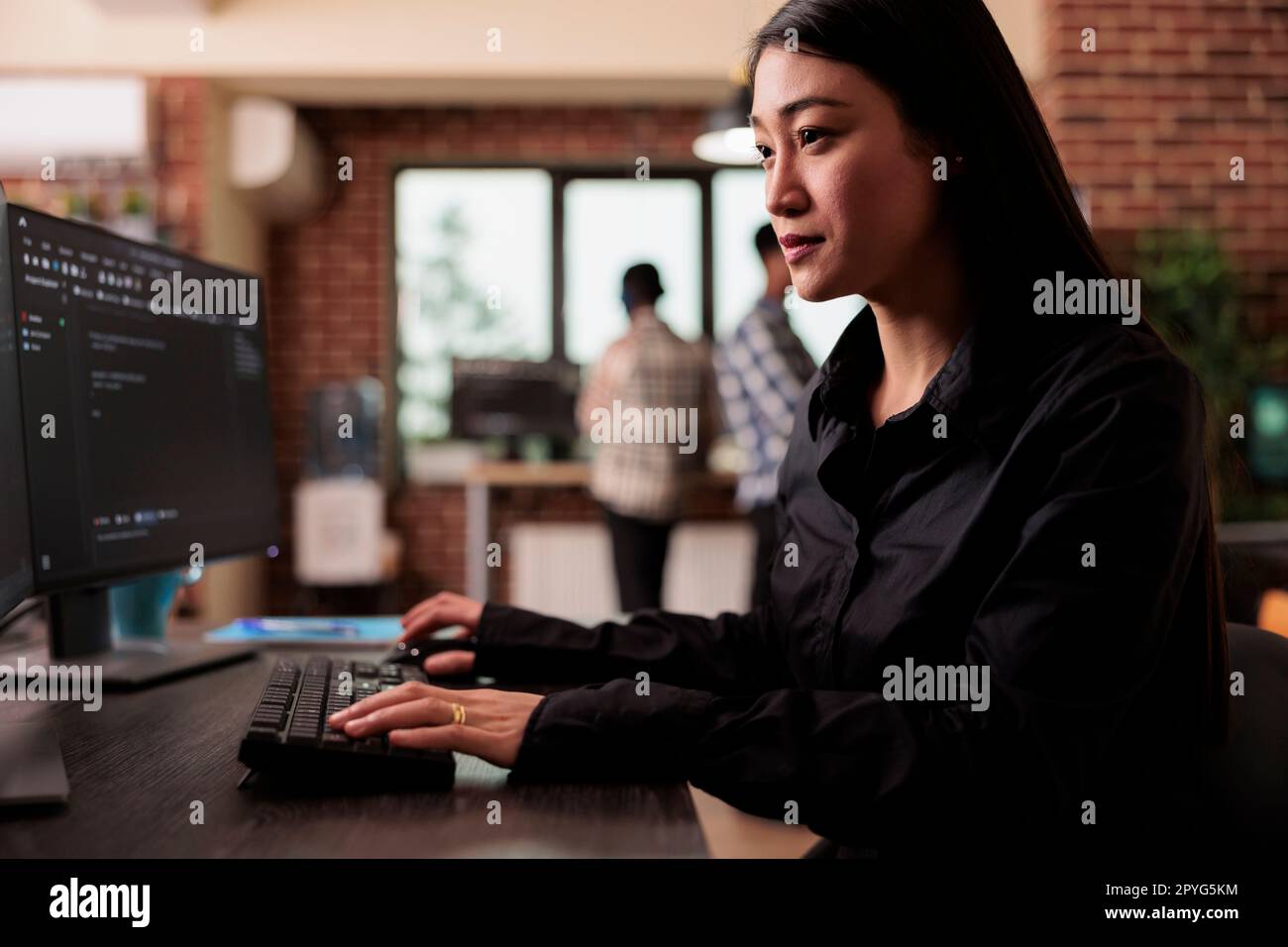 Software developer writing javascript code on terminal window, working ... Software developer writing javascript code on terminal window, working ...