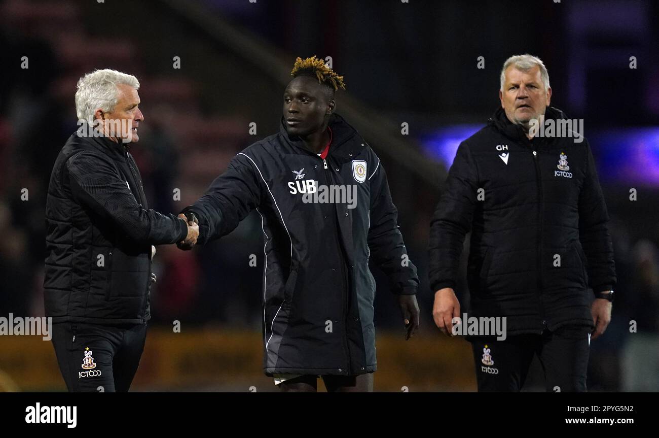 Bradford City manager Mark Hughes (left) shaks hands with Crewe ...