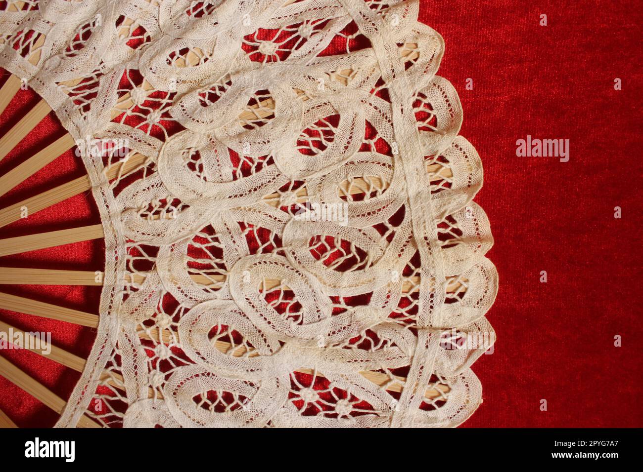 Vintage Lace Hand Fan On Red Velvet Background Stock Photo - Alamy