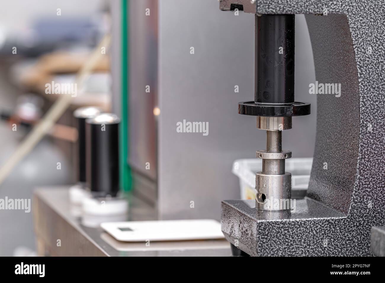 closed with the lid of beverage cans in an automatic capping machine in ...