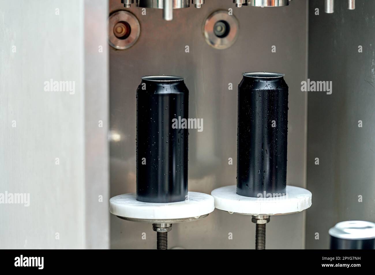 automatic filling and sealing of drink cans in the factory Stock Photo ...
