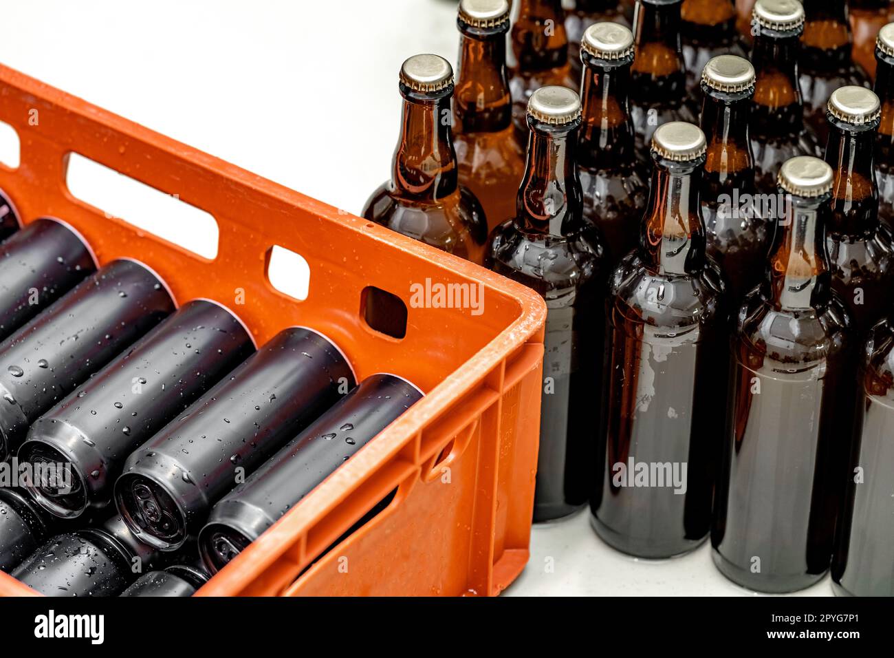 beer bottles and beverage cans in the brewery warehouse Stock Photo - Alamy