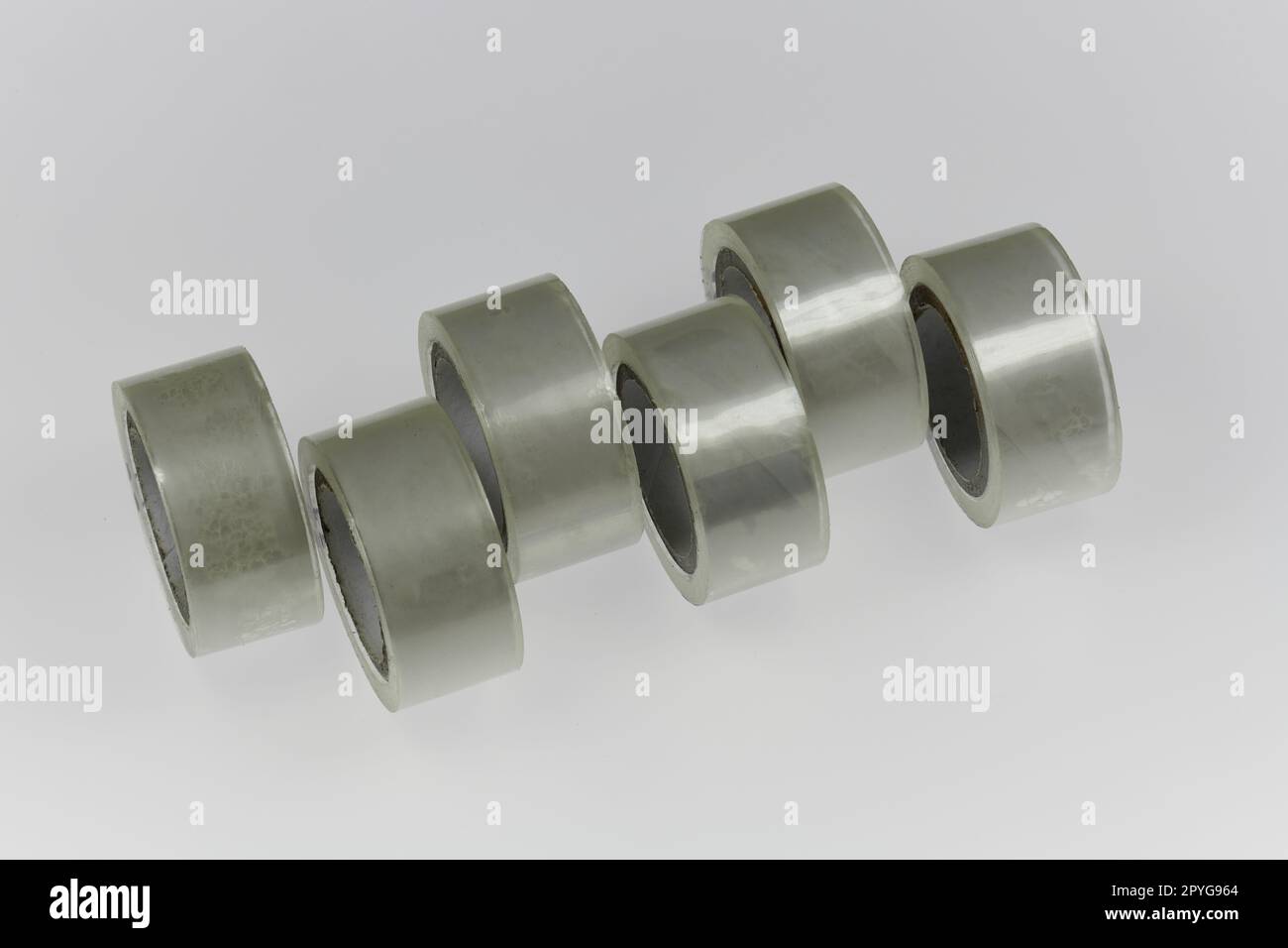 new adhesive gluing plastic film tapes on white Stock Photo - Alamy