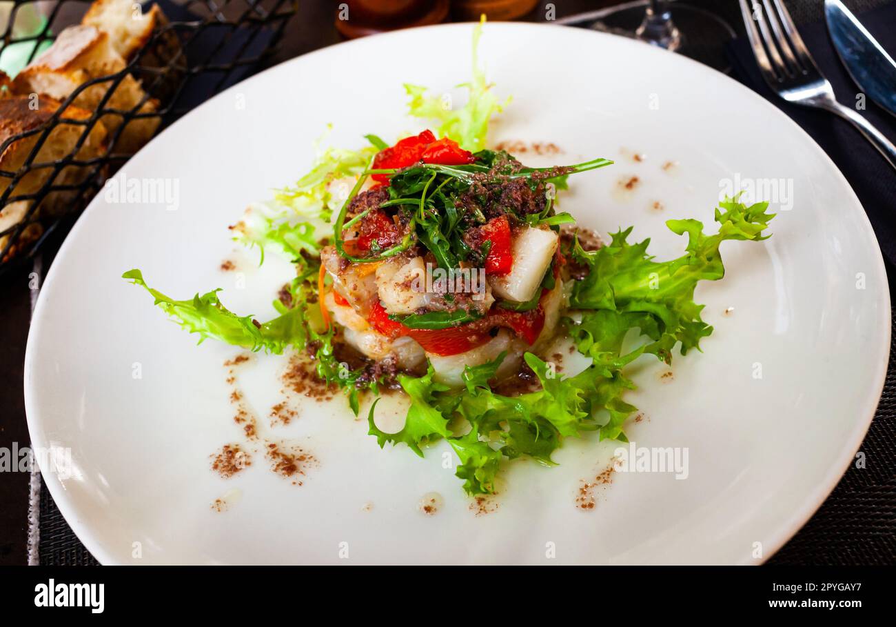 Cod timbale with baked red pepper, rocket and olive tapenade Stock ...