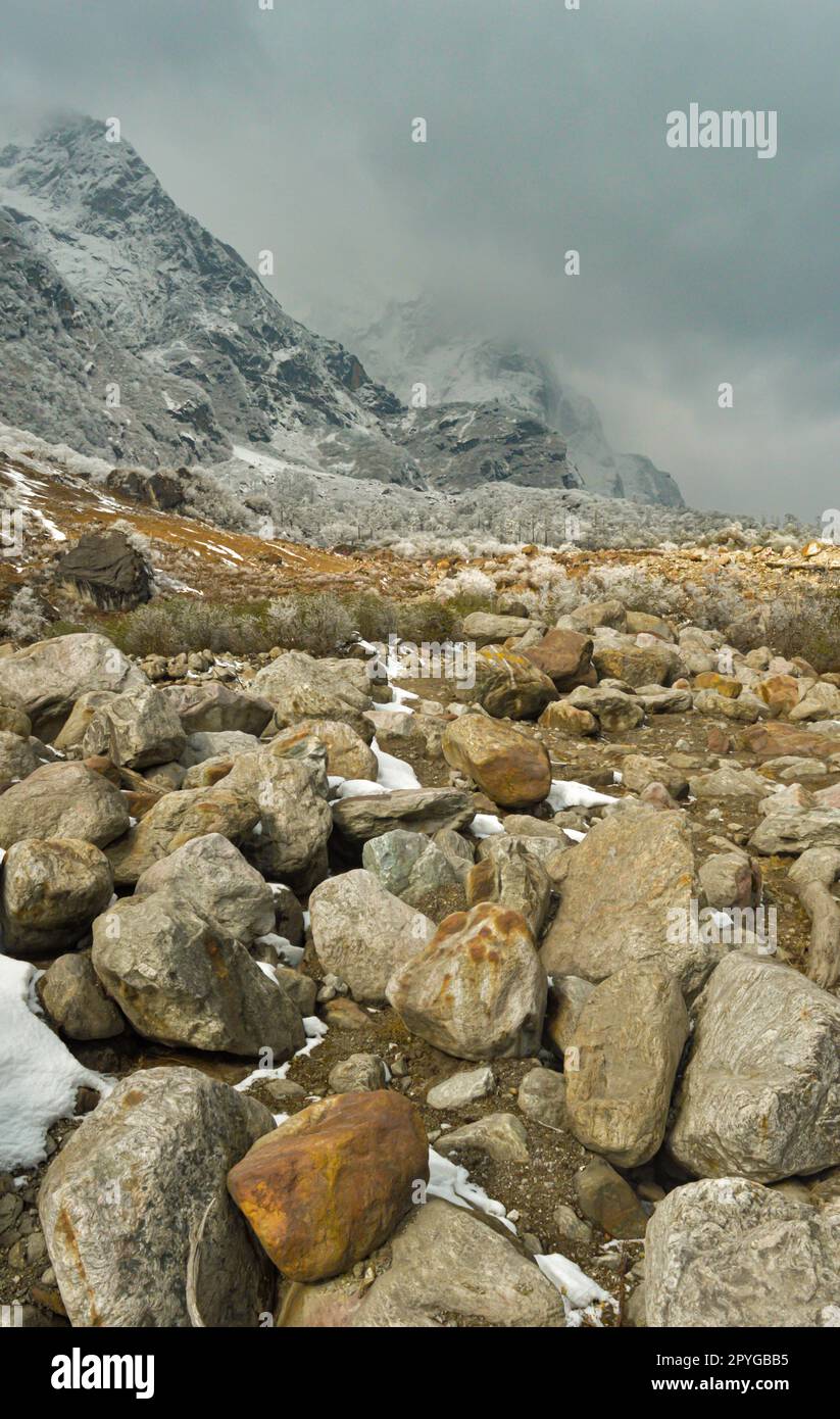 Rocky Mountain Boulder Rocks against foggy cloudy mountain background ...