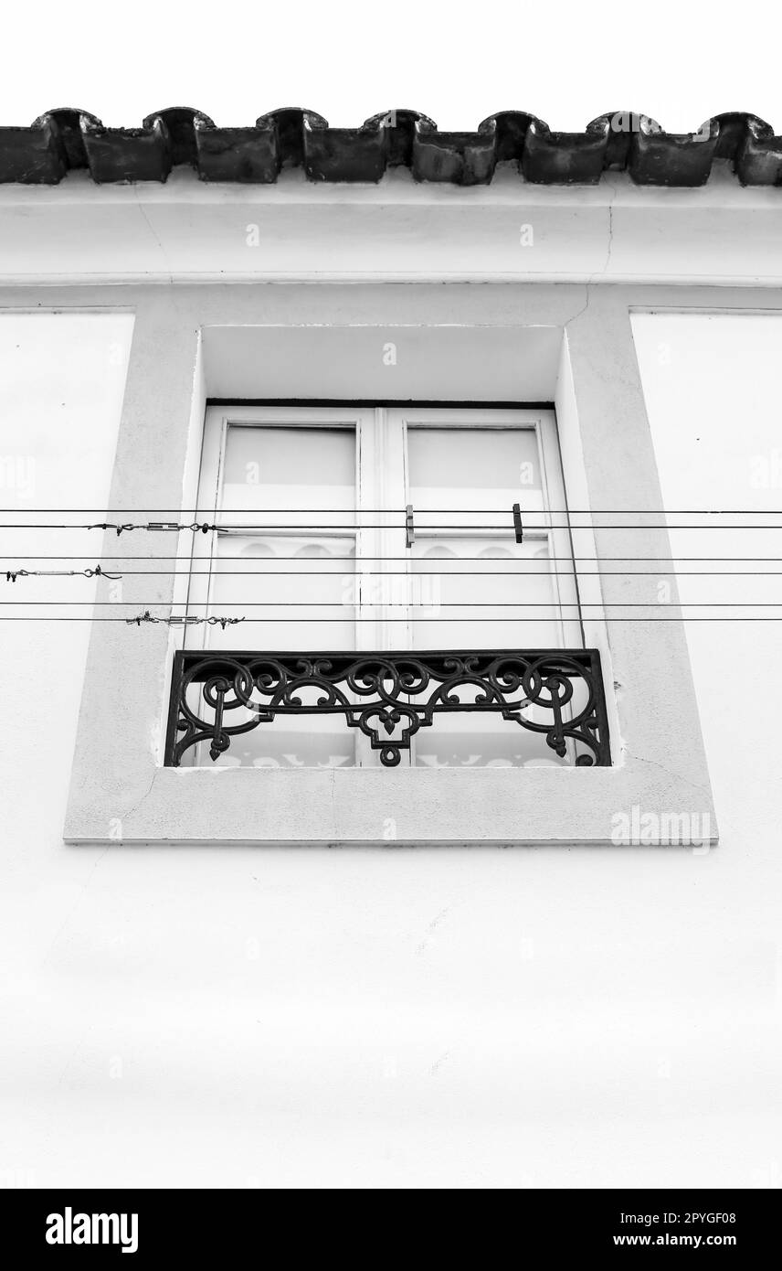 Typical Portuguese window with hanging clothes. Monochrome picture ...