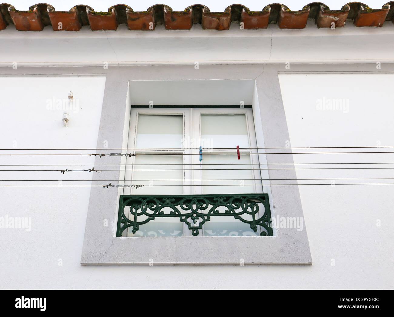 Typical Portuguese window with hanging clothes Stock Photo - Alamy