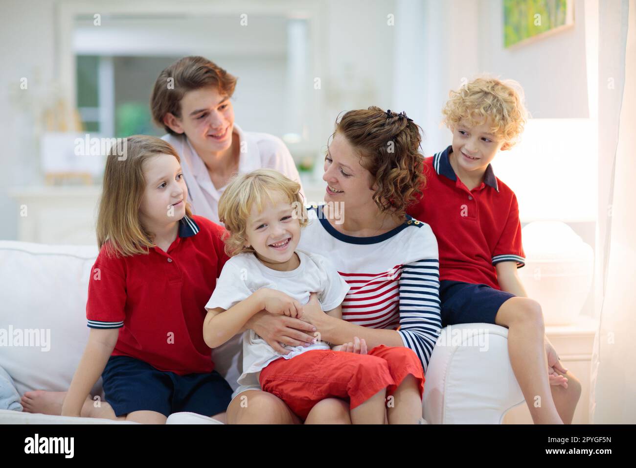 Mother and kids at home. Happy family with children. Mom and four ...