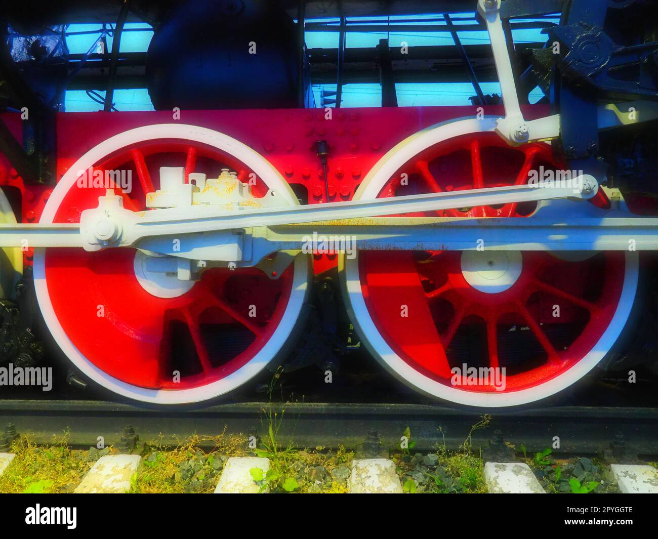 Retro vintage wheels of a locomotive or train close up. Red large heavy ...