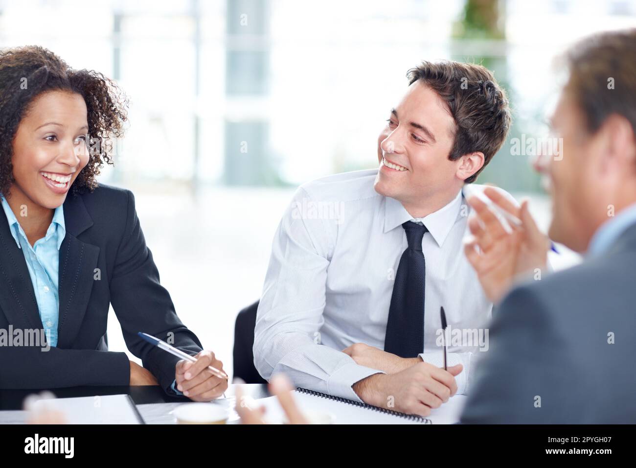 Finding new ways of boosting their success. Happy business colleagues ...