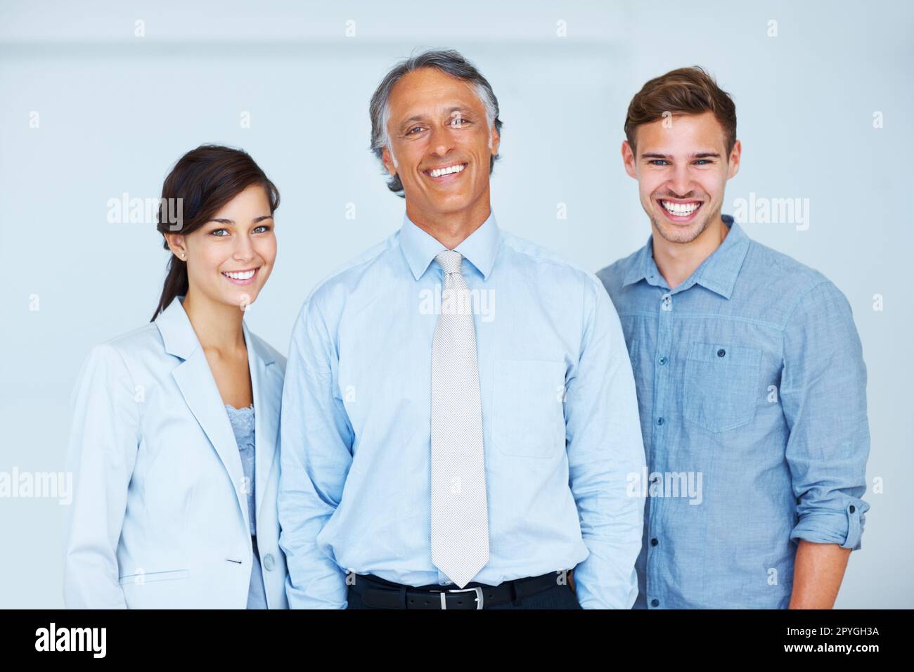 Team of three hi-res stock photography and images - Alamy