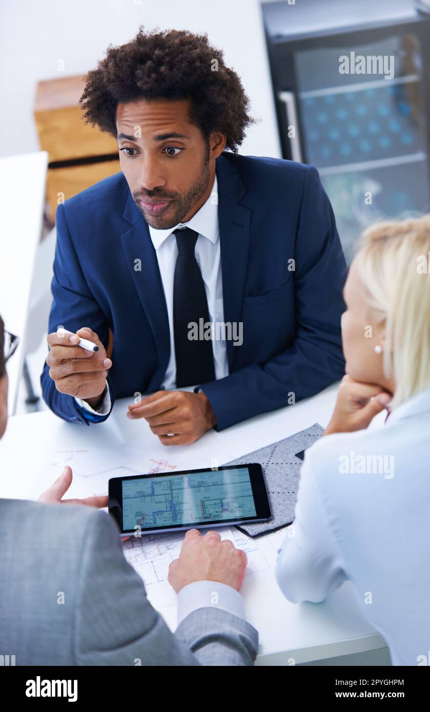 Time to take the lead. a businessman involved in a discussion with ...