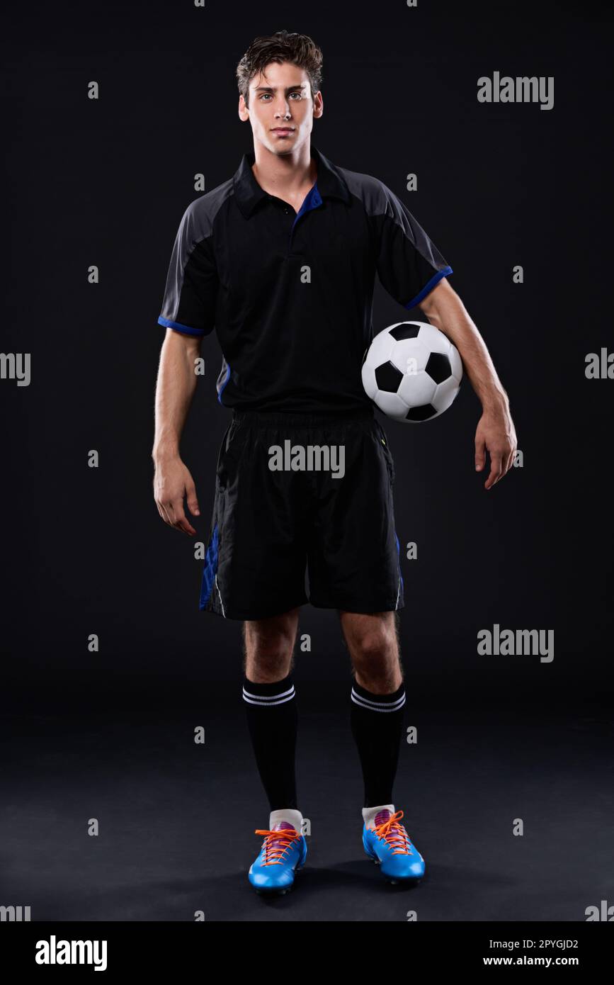 Soccer is more than a game, its a passion. Full length studio shot of a ...