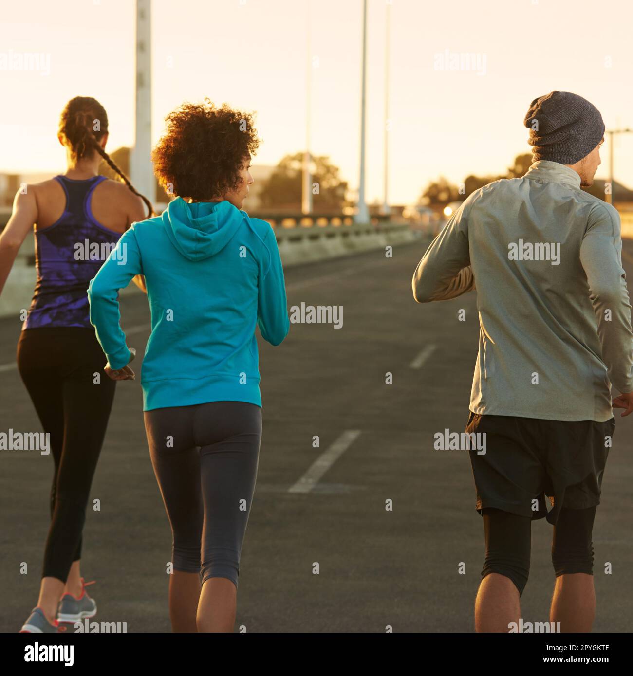 Three joggers hi-res stock photography and images - Alamy