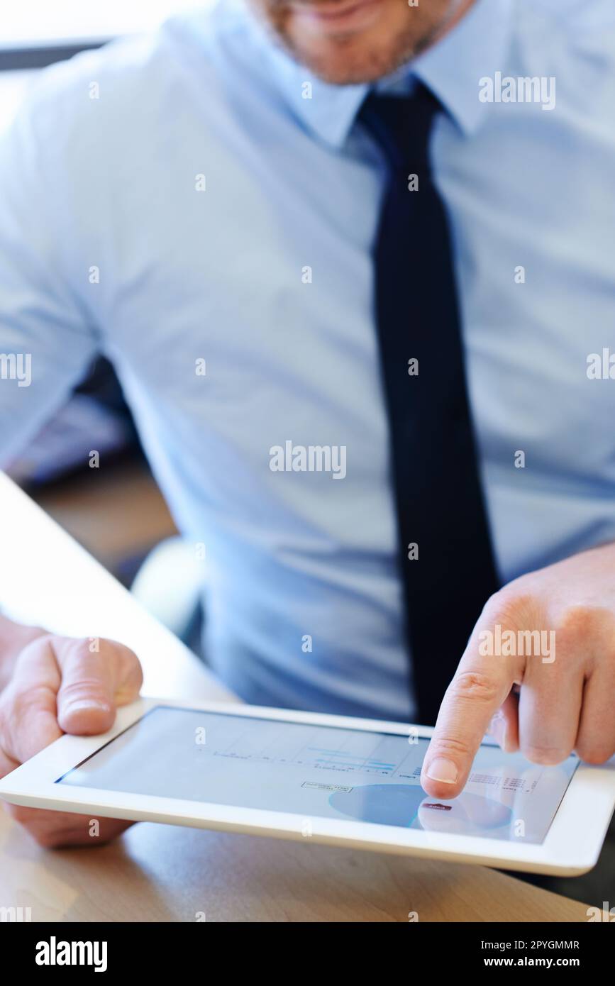 These projections look promising. a businessman working on a digital ...