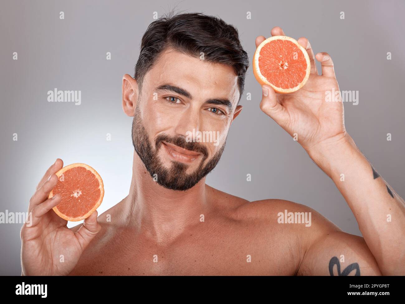 Face portrait, skincare and man with grapefruit in studio isolated on a ...