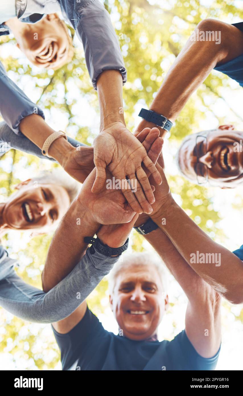 Senior hands, together and support with solidarity outdoor and group ...