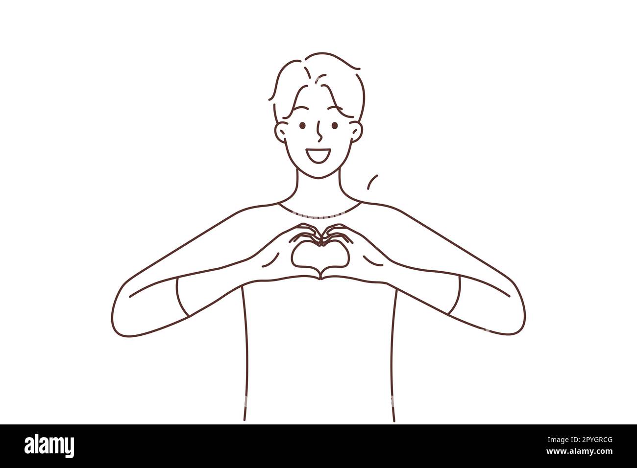 Smiling young man show heart hand gesture share care and support. Happy ...