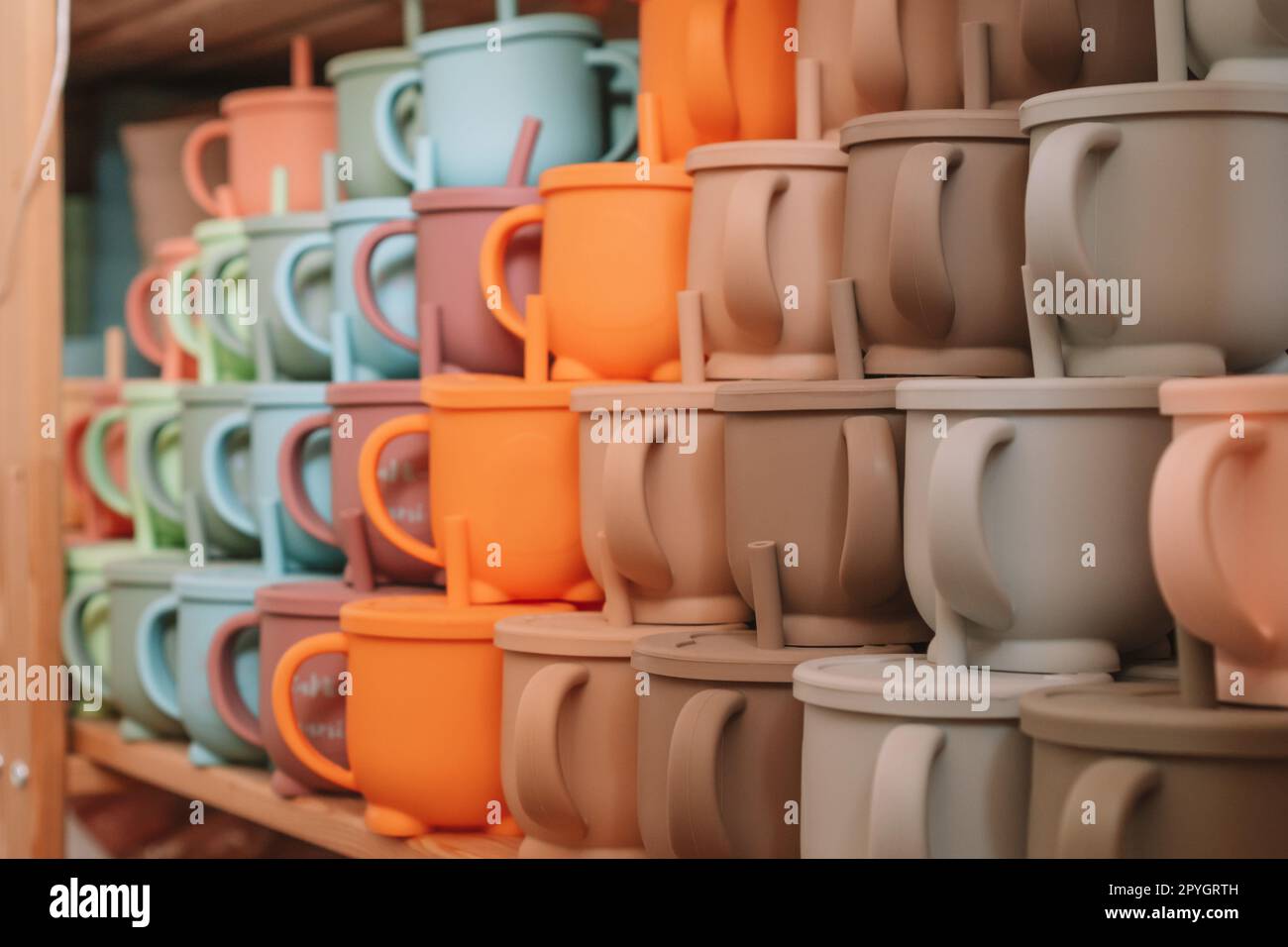 Multicolored silicone baby tableware stack with handles and forms on ...