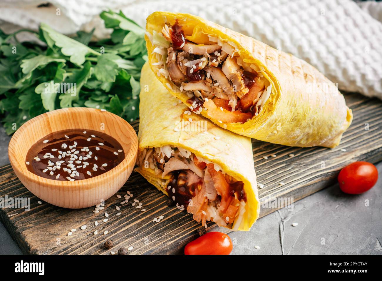 Roll shawarma with sesame seeds, barbecue sauce, chicken in pita bread ...