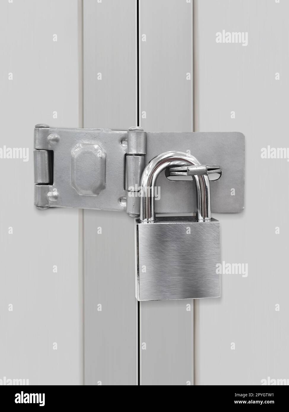 Closed padlock on a metal door Stock Photo - Alamy
