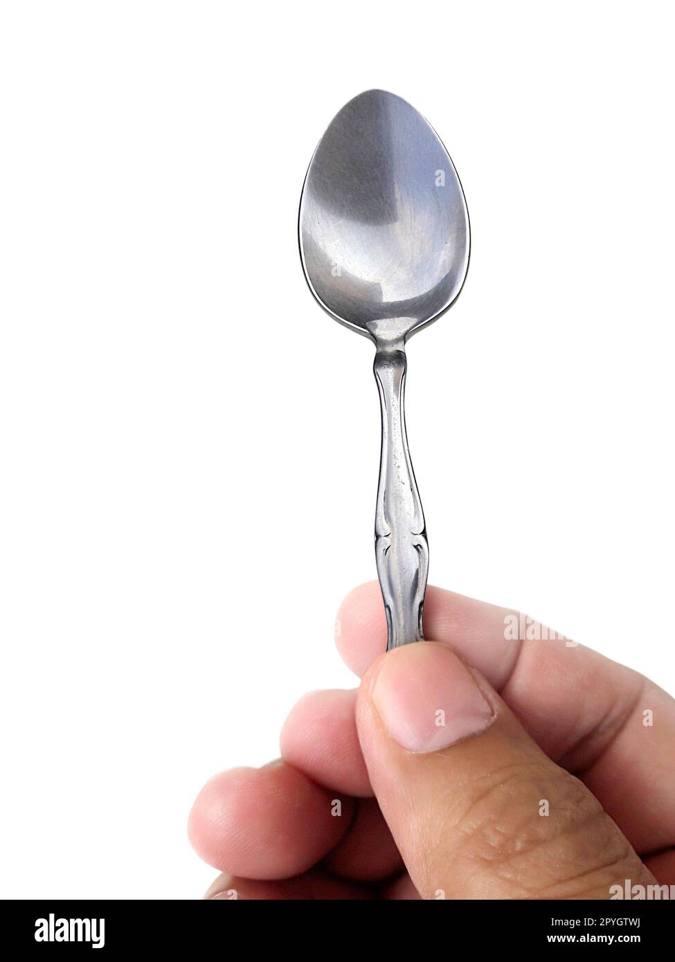 Hand holding spoon isolated on white background Stock Photo - Alamy