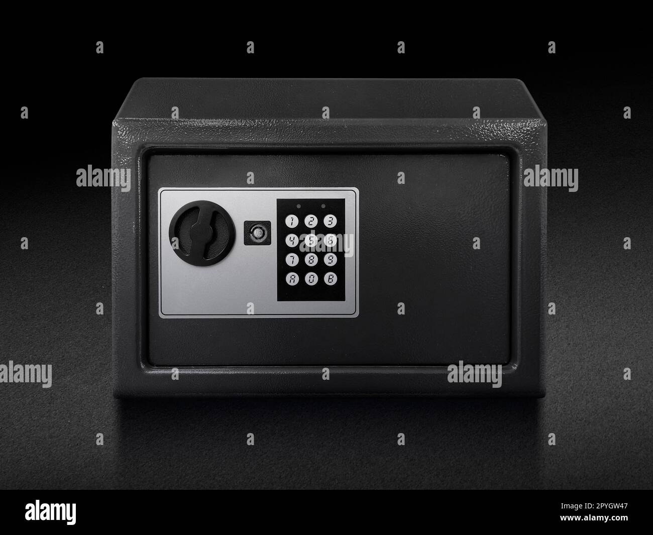 Steel money bank safe on a dark background Stock Photo - Alamy