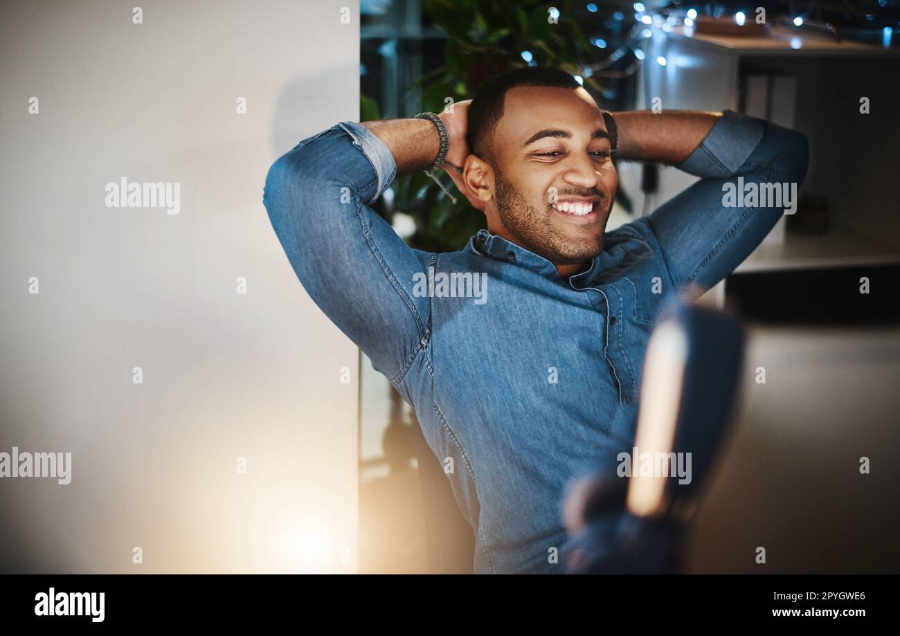 He worked hard, it paid off. a young businessman taking a break at his ...