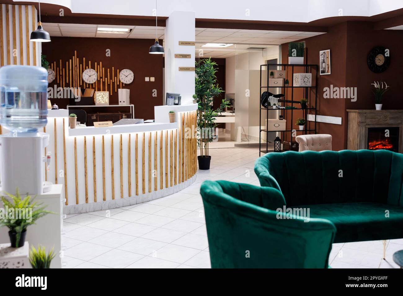 Empty hotel reception with lounge area and front desk used for check in ...