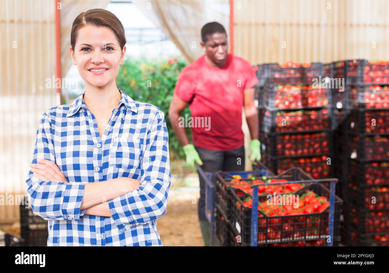 Confident woman greenhouse owner in vegetable store Stock Photo - Alamy